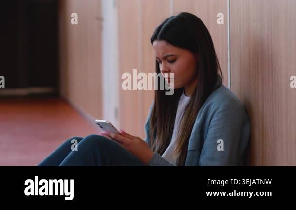 Caucasian sad student girl reading bad news mobile phone thinking teen ...