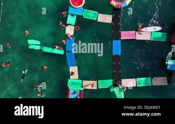 4K Drone shot rising over ocean waterpark with moored boats Stock Video ...