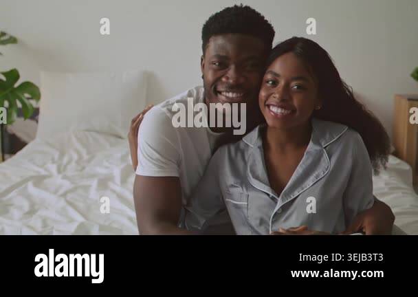 A young African American man and a young African American woman are ...