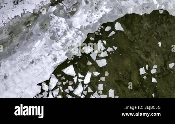 Aerial still top down video of frozen Baltic Sea coastline at Turisalu ...