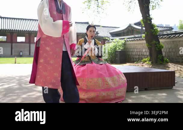 People wearing traditional korean hanbok costumes outdoors Stock Video ...
