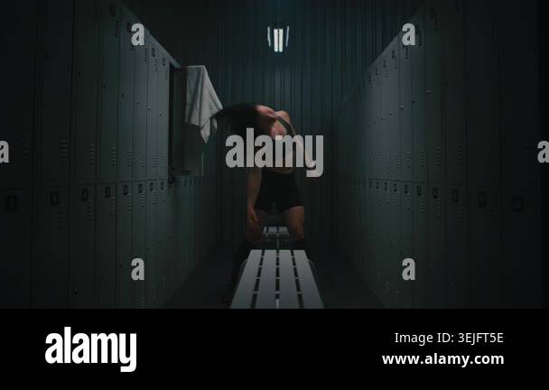 Athletic Curly Woman Dancing With Joy in Empty Locker Room. Fit Female ...