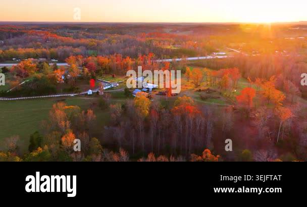 Spacious rural houses among yellow fall foliage in South Carolina ...