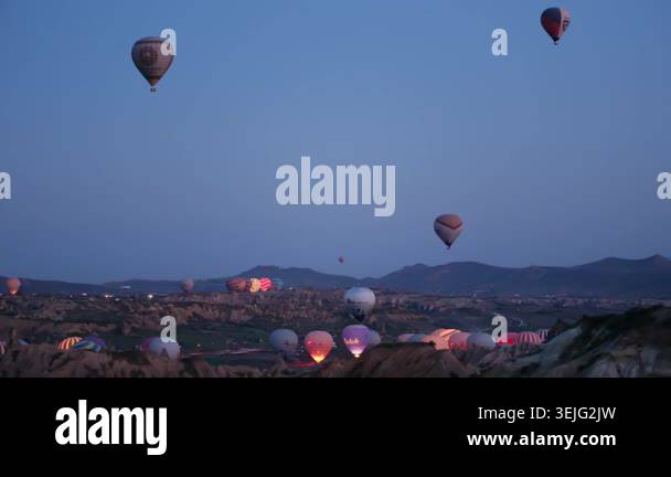 Witness the enchanting sight of colorful hot air balloons rising over ...