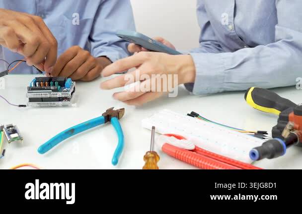 Close-up, Hand man and woman connecting soil moisture sensors to ...