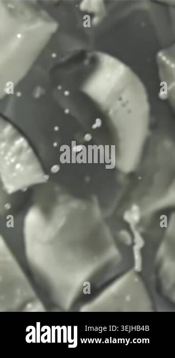 Pieces of coconut fly up and fall down. Filmed on a high-speed camera ...