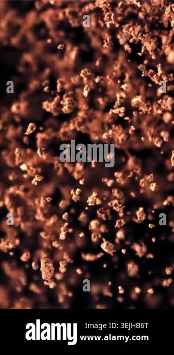 Ground coffee flies up and falls down. Filmed on a high-speed camera at ...