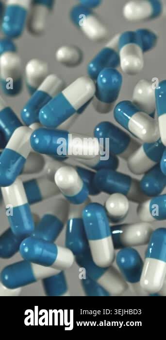 Grey background blue white capsules floating densely in methodical ...