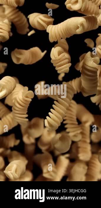 Fusili pasta rises and falls. Filmed on a high-speed camera at 1000 fps ...