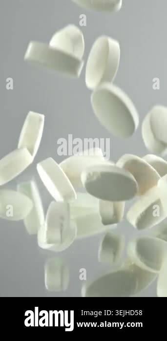 White tablets floating against neutral background minimalist product ...