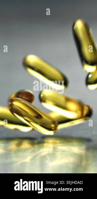 Softgel omega capsules scatter across metallic countertop, industrial ...