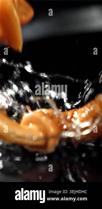 Drop pickled mushrooms with splashes. Filmed on a high-speed camera at ...