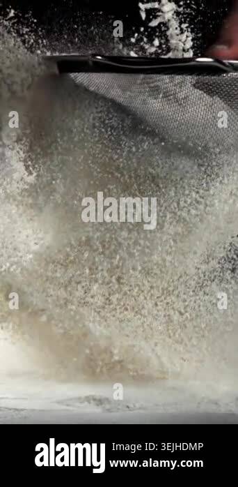 The cook sifts the flour. Filmed on a high-speed camera at 1000 fps ...