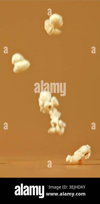 Popcorn falls on the table. Filmed on a high-speed camera at 1000 fps ...