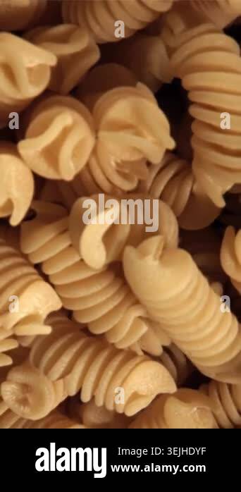 Fusili pasta rises and falls. Filmed on a high-speed camera at 1000 fps ...