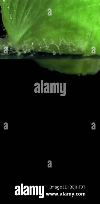 Super slow motion forks of fresh cabbage falls under the water with air ...