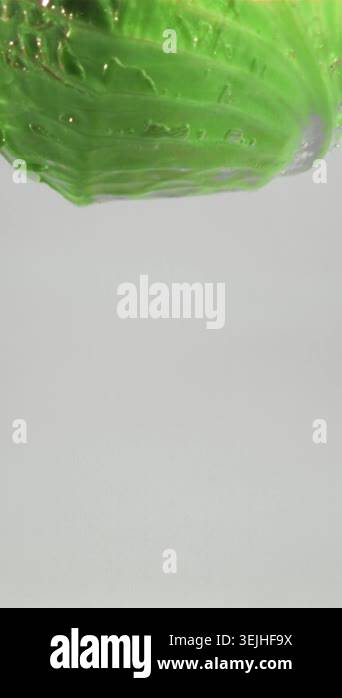 Super slow motion under the water falls forks cabbage with air bubbles ...