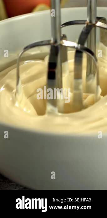 Super slow motion mixer stirred mayonnaise into the bowl. Filmed on a ...