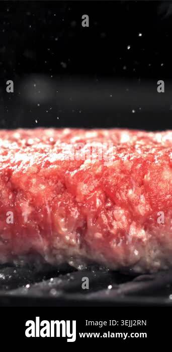 A beef burger is fried in a pan. Filmed on a high-speed camera at 1000 ...