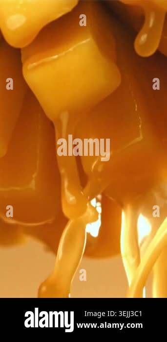 The juice flows through the sliced mango fruit. Filmed on a high-speed ...