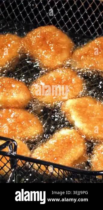 Nuggets with splash oil. Filmed is slow motion 1000 fps. High quality ...