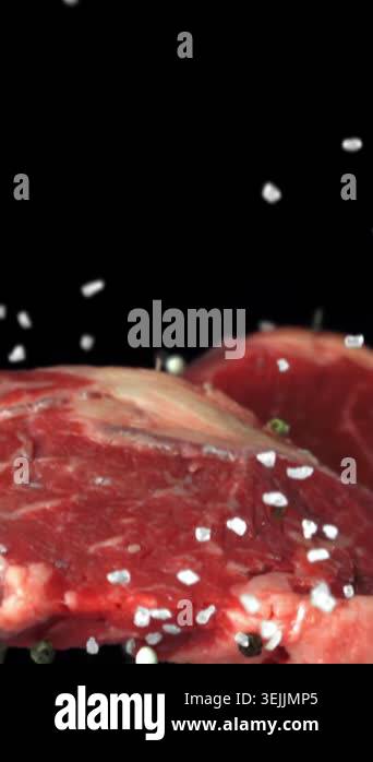 Beef ribeye steak fly up and falls down. Filmed on a high-speed camera ...