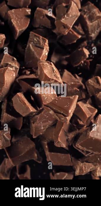 Pieces of chocolate fly up and fall down. Filmed on a high-speed camera ...