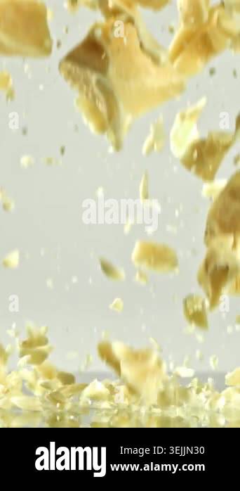 Super slow motion Pieces of white chocolate . Filmed on a high-speed ...