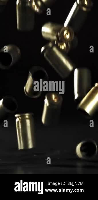 Bullet casings are pressed on the table. Filmed on a high-speed camera ...