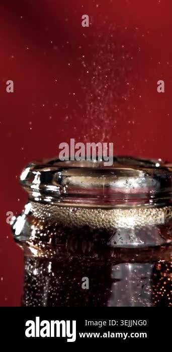 An open bottle of cola. Filmed on a high-speed camera at 1000 fps. High ...