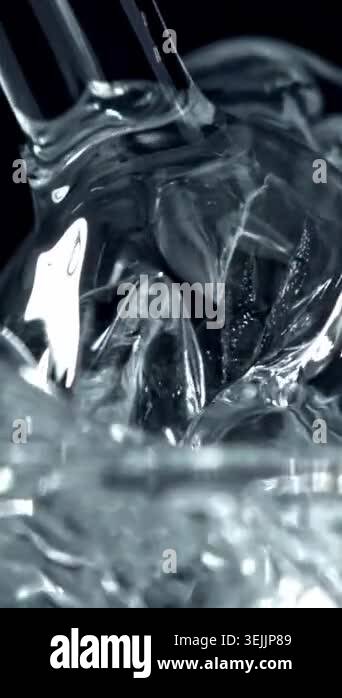 Vodka with ice. Filmed on a high-speed camera at 1000 fps. High quality ...