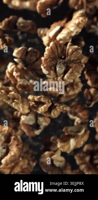 Walnuts fly up and fall down. Filmed on a high-speed camera at 1000 fps ...