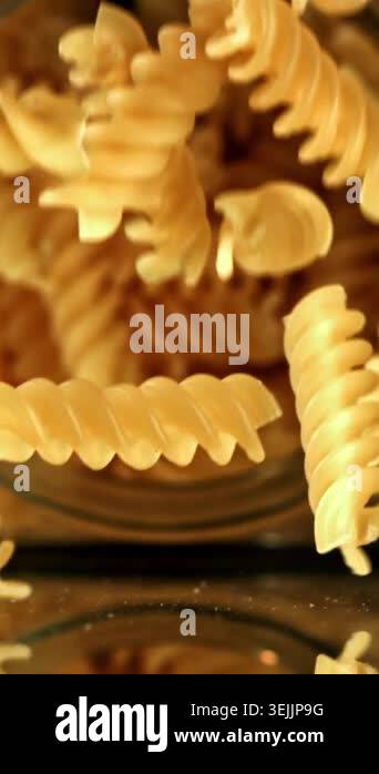 Super slow motion fusilli pasta dry . Filmed on a high-speed camera at ...