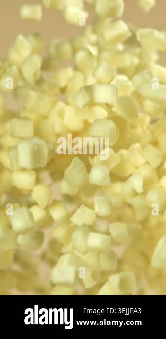 The mozzarella cheese flies up on a light background. Filmed on a high ...