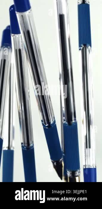 School pens fly up and down. Filmed on a high-speed camera at 1000 fps ...