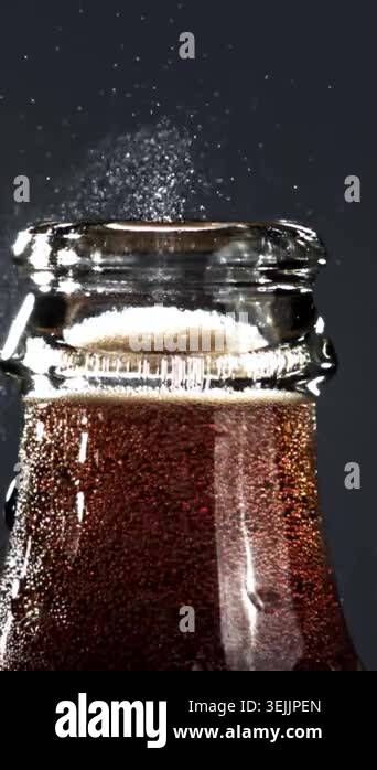 An open bottle of cola. Filmed on a high-speed camera at 1000 fps. High ...