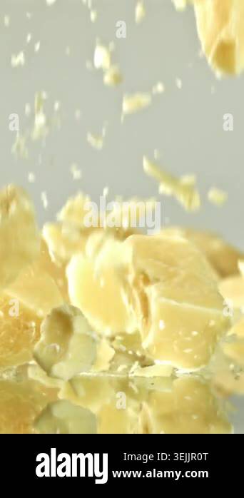 Super slow motion Pieces of white chocolate . Filmed on a high-speed ...