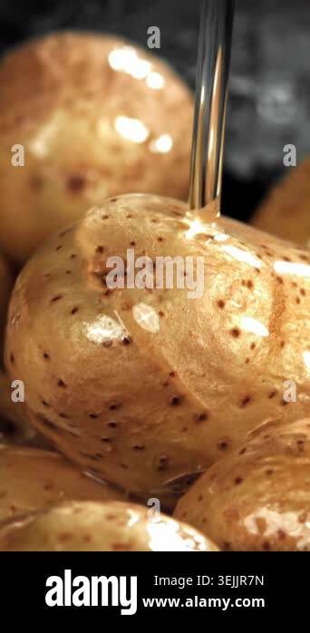 The potatoes are fried in a large frying pan. Filmed on a high-speed ...