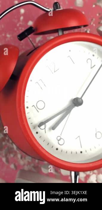 Alarm clock and school crayons fly up on a black background. Filmed on ...