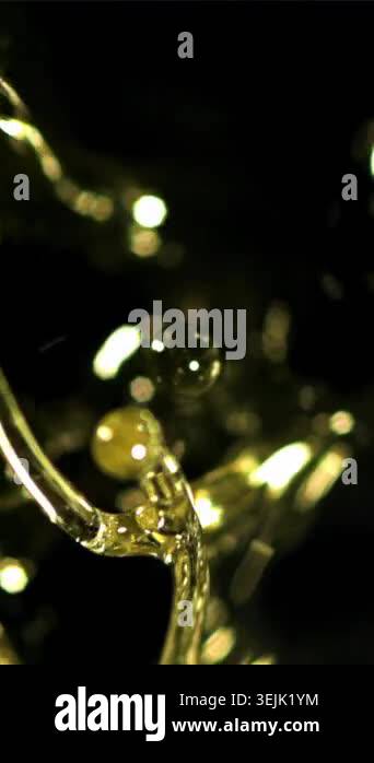 Splashes with drops of olive oil. Filmed on a high-speed camera at 1000 ...