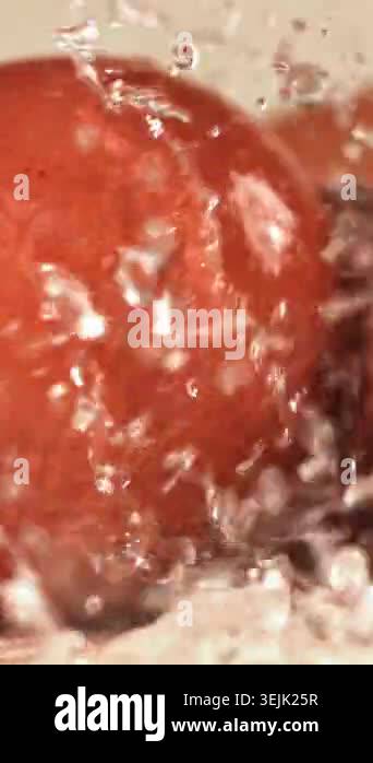 Drops of water fall on chicken eggs. Filmed on a high-speed camera at ...