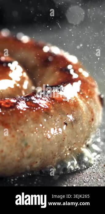 Sausages are grilled. Filmed on a high-speed camera at 1000 fps. High ...