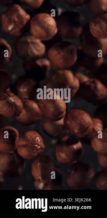 Hazelnuts fly up and fall down. Filmed on a high-speed camera at 1000 ...