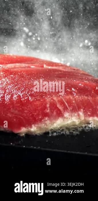 Grilled tuna steak. Filmed on a high-speed camera at 1000 fps. High ...