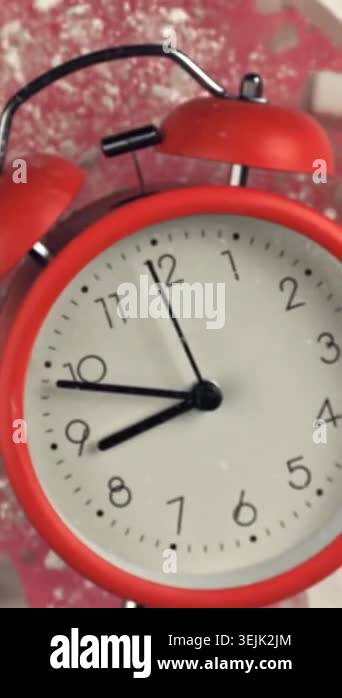 Alarm clock and school crayons fly up on a black background. Filmed on ...
