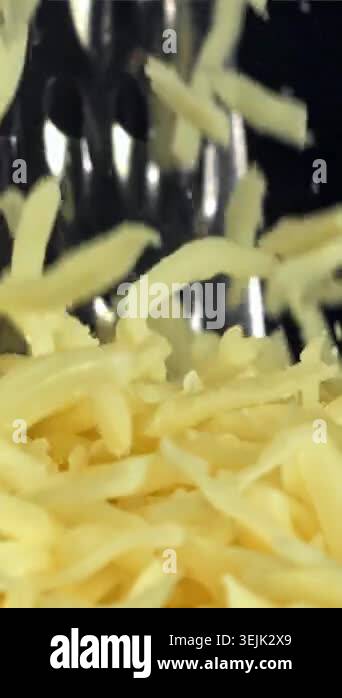 The grated cheese falls down. Filmed on a high-speed camera at 1000 fps ...