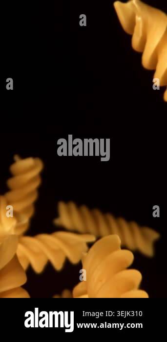Super slow motion fusilli pasta dry . Filmed on a high-speed camera at ...