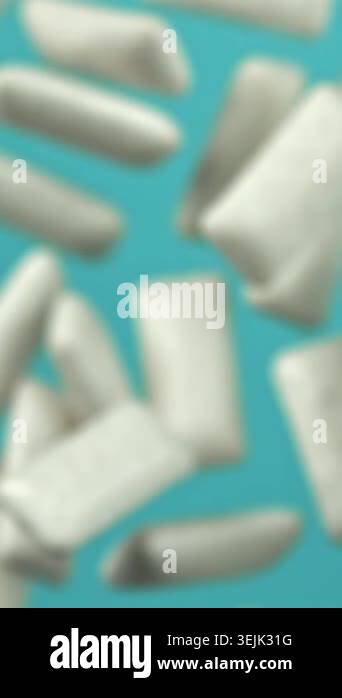 Chewing gum flies on a blue background. Filmed on a high-speed camera ...