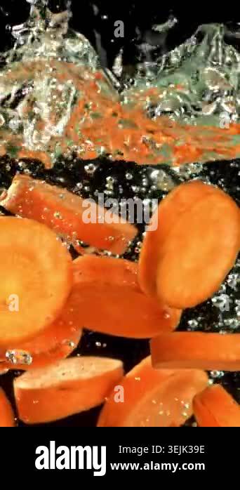 Super slow motion carrot slices. Filmed on a high-speed camera at 1000 ...
