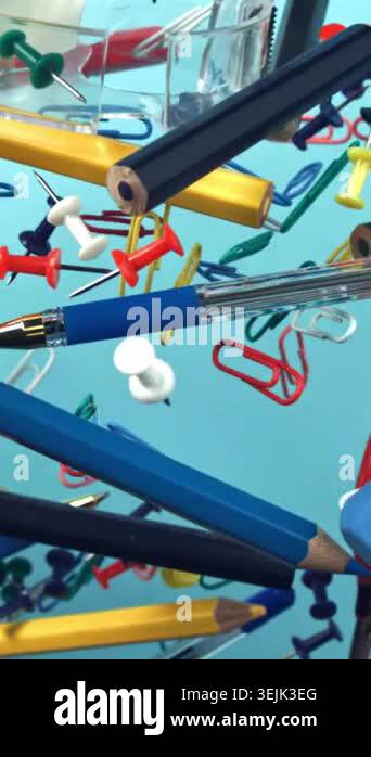 Different school tools fly up and down. Back to school. Filmed on a ...